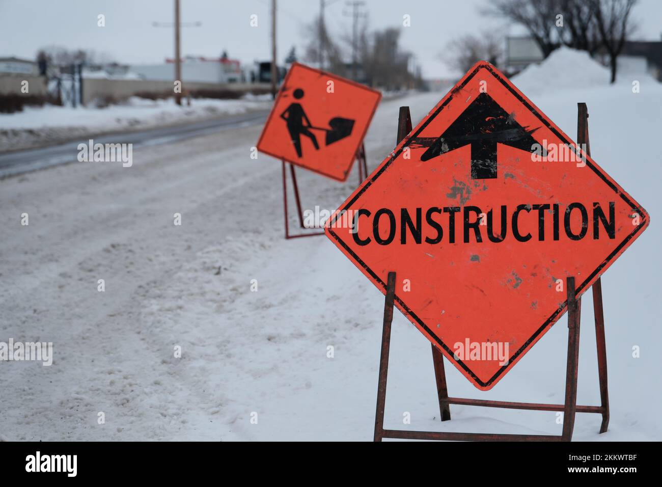 construction site signs on snow covered road Stock Photo - Alamy