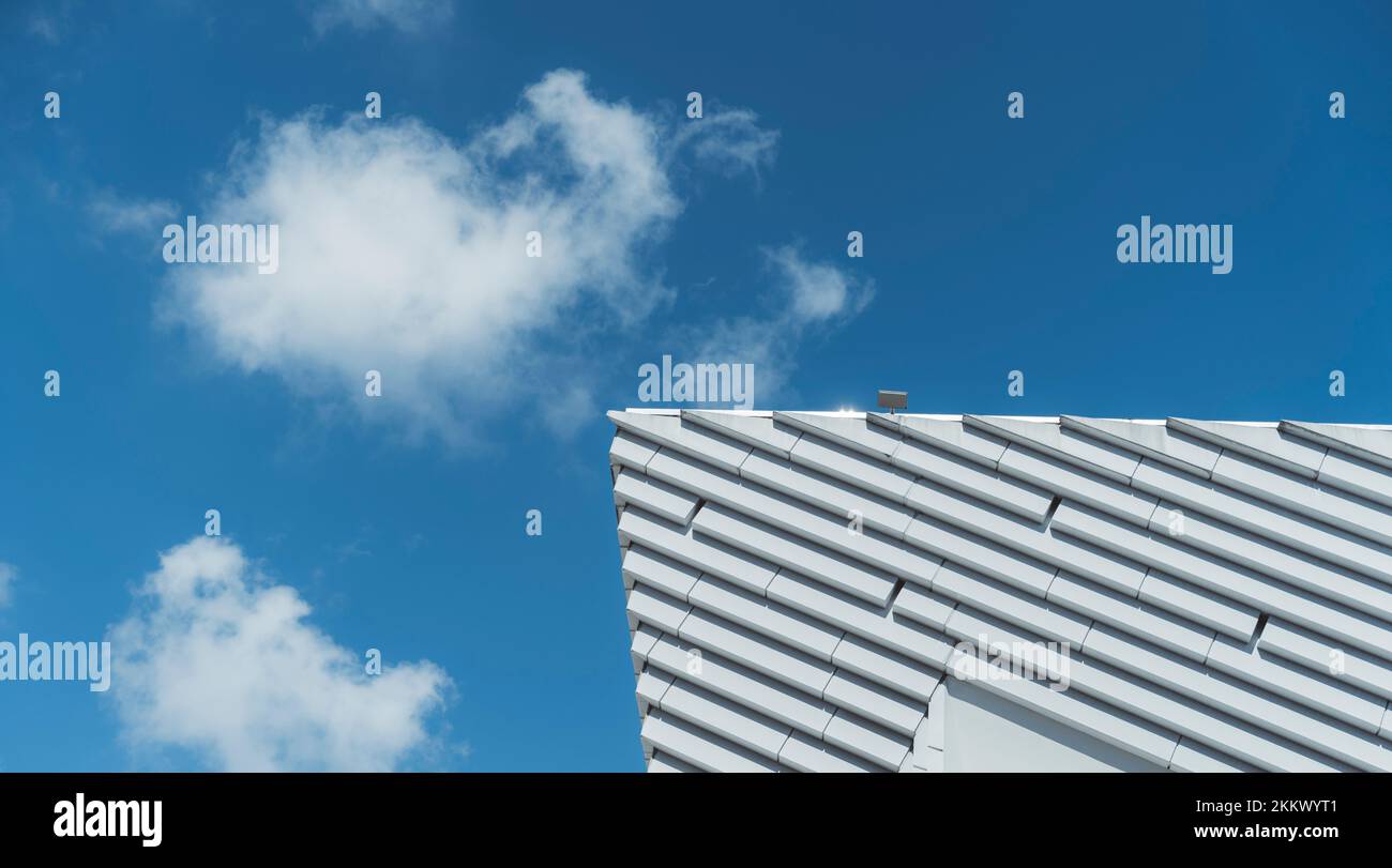 A low angle shot of a roof building with stripped white and black lines ...
