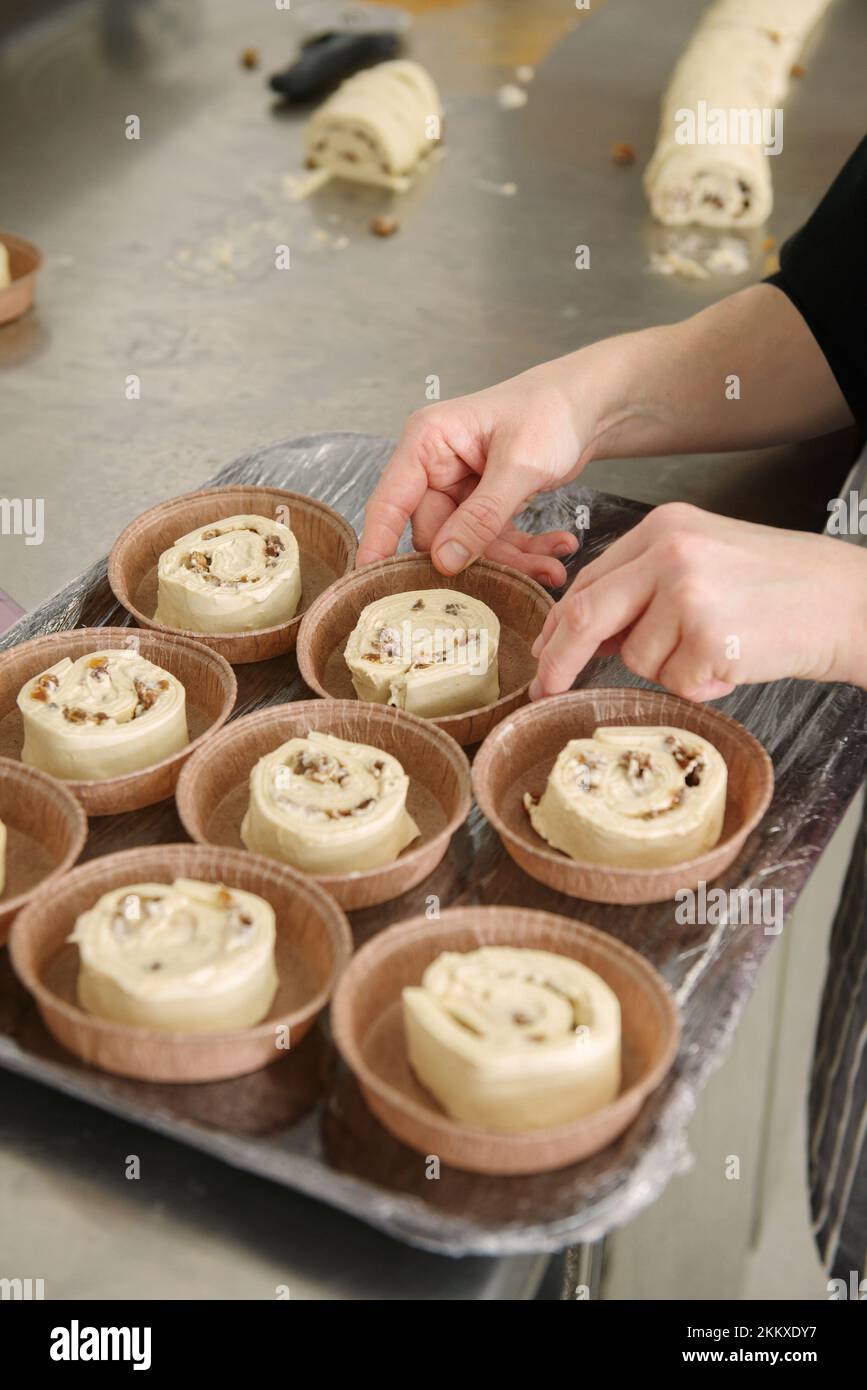 A closeup of hands making dessert in a bakery Stock Photo - Alamy