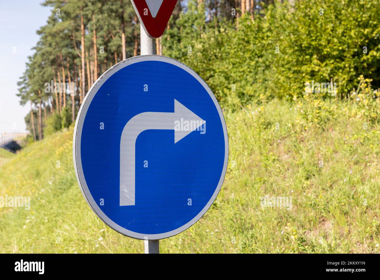 A road sign indicating the direction of movement for transport, a ...