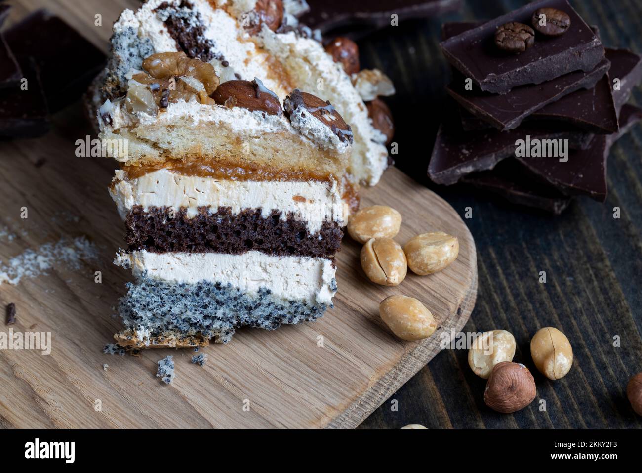 multi-layer cake with different layers, caramel, poppy seeds and cream ...