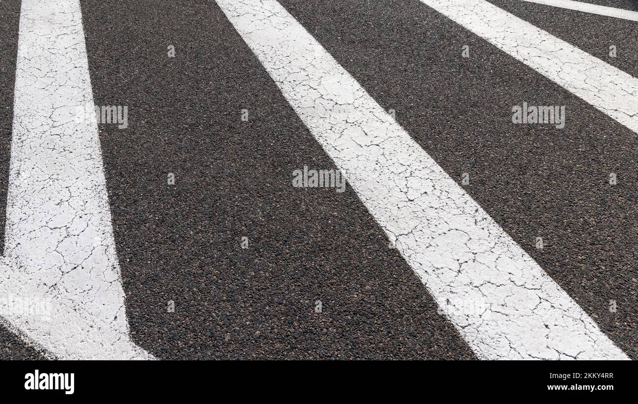 Paved highway with white road markings, traffic regulation using lines ...