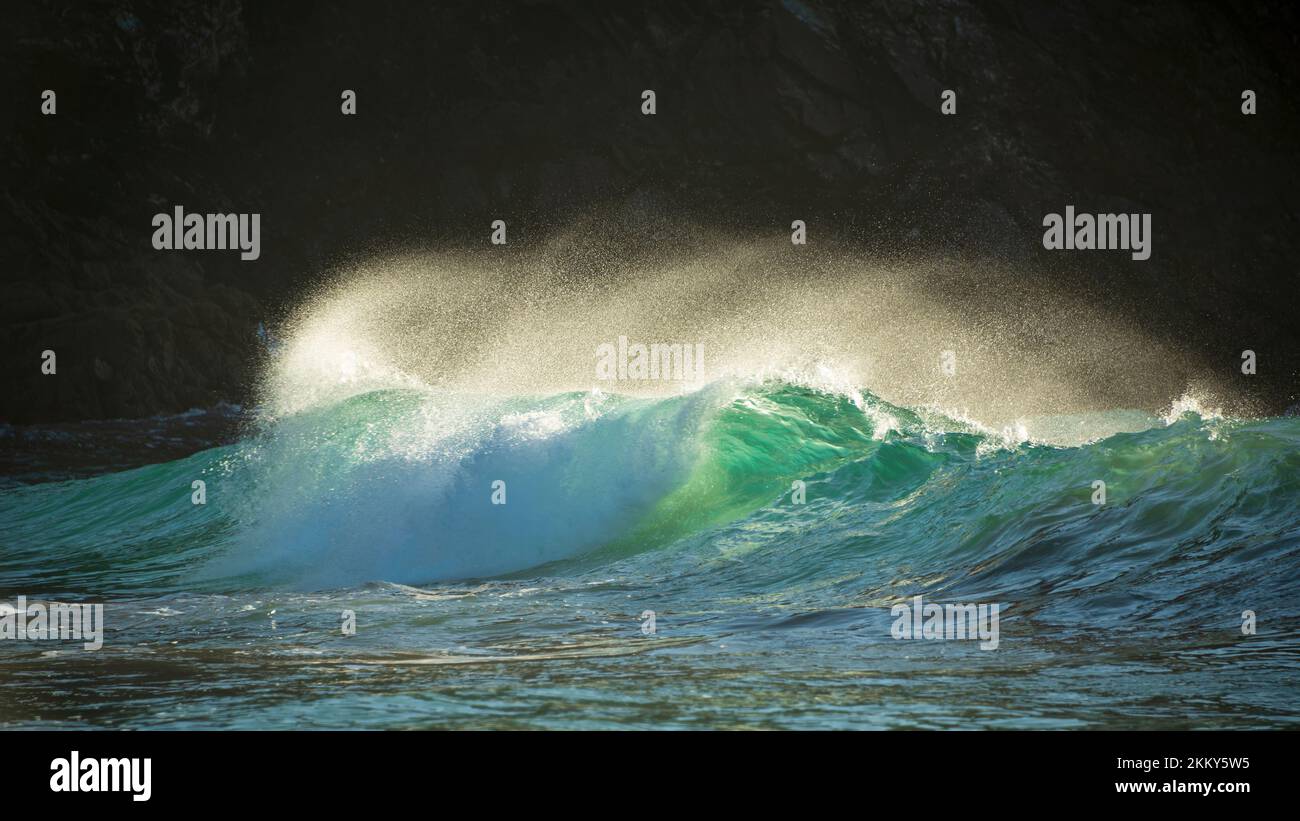 Epic landscape image of jade turquoise waves crashing onto shore and ...
