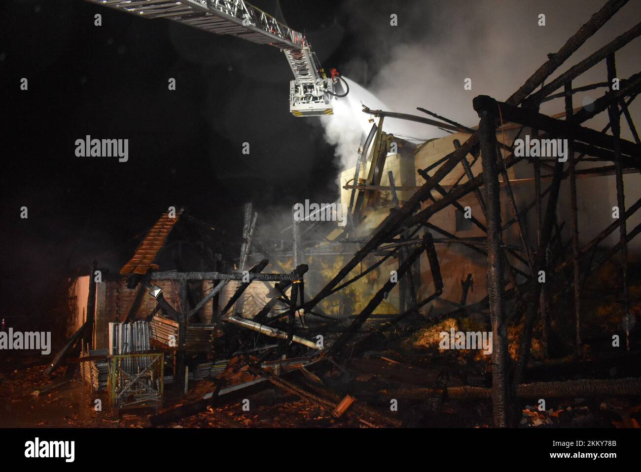 Erkheim, Germany. 26th Nov, 2022. Extinguishing a fire in a warehouse ...