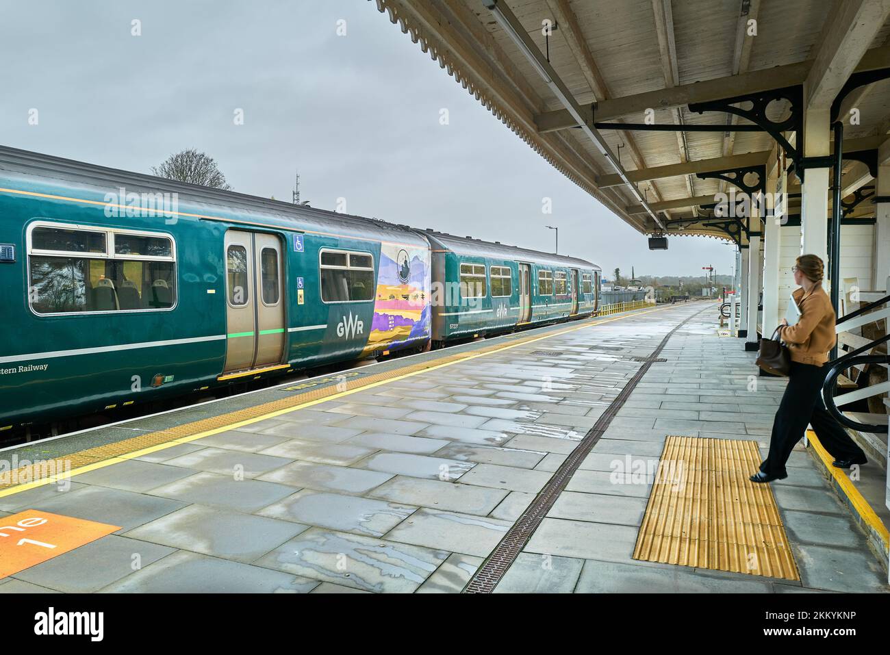 A passenger about to enter a train of the GWR branch line between St ...