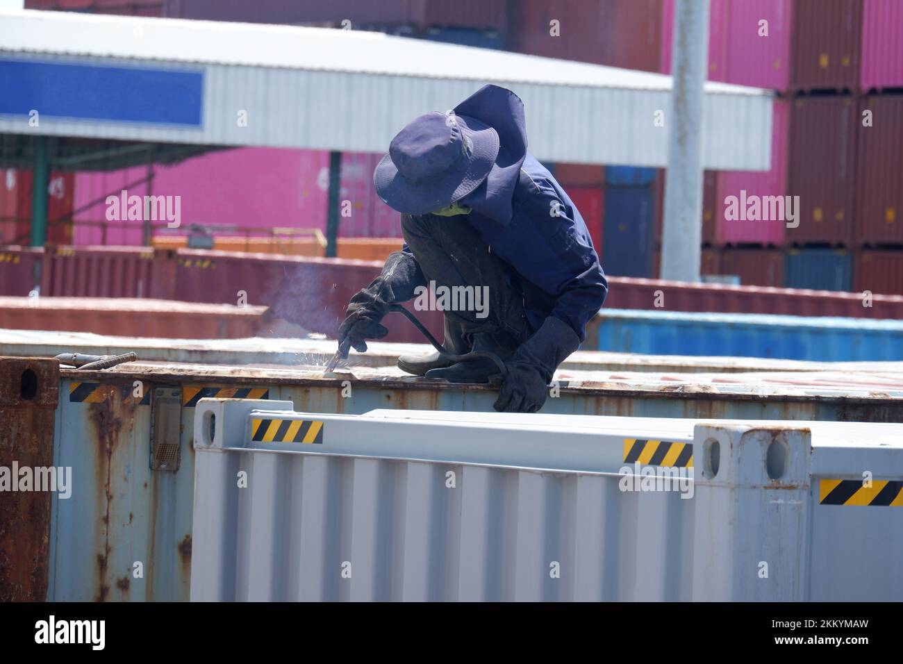 container repairman in the container yard Stock Photo - Alamy