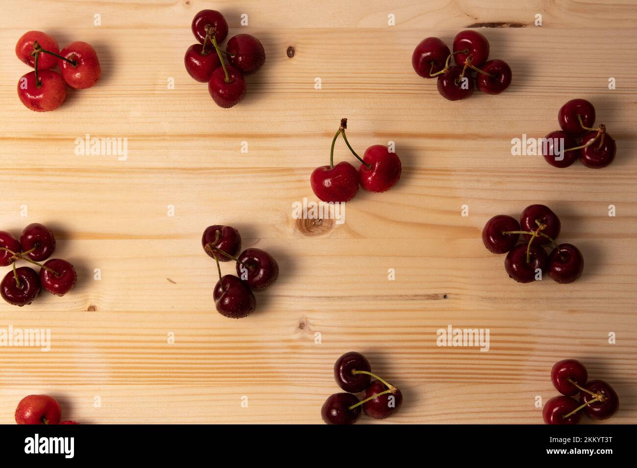 Fresh ripe cherries on a wooden board top view Stock Photo - Alamy