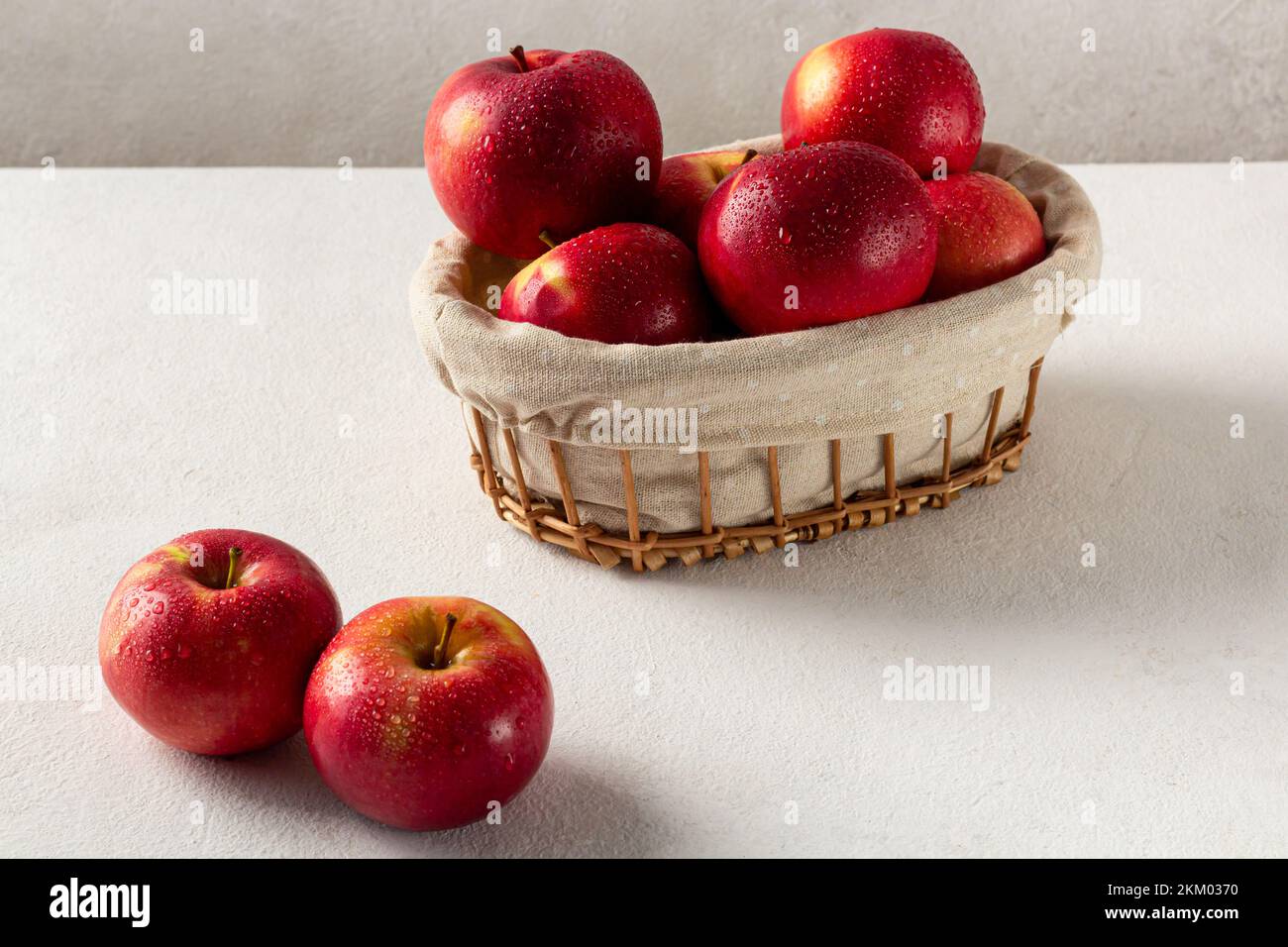 Fresh ripe red apples on a gray background, side view Stock Photo - Alamy