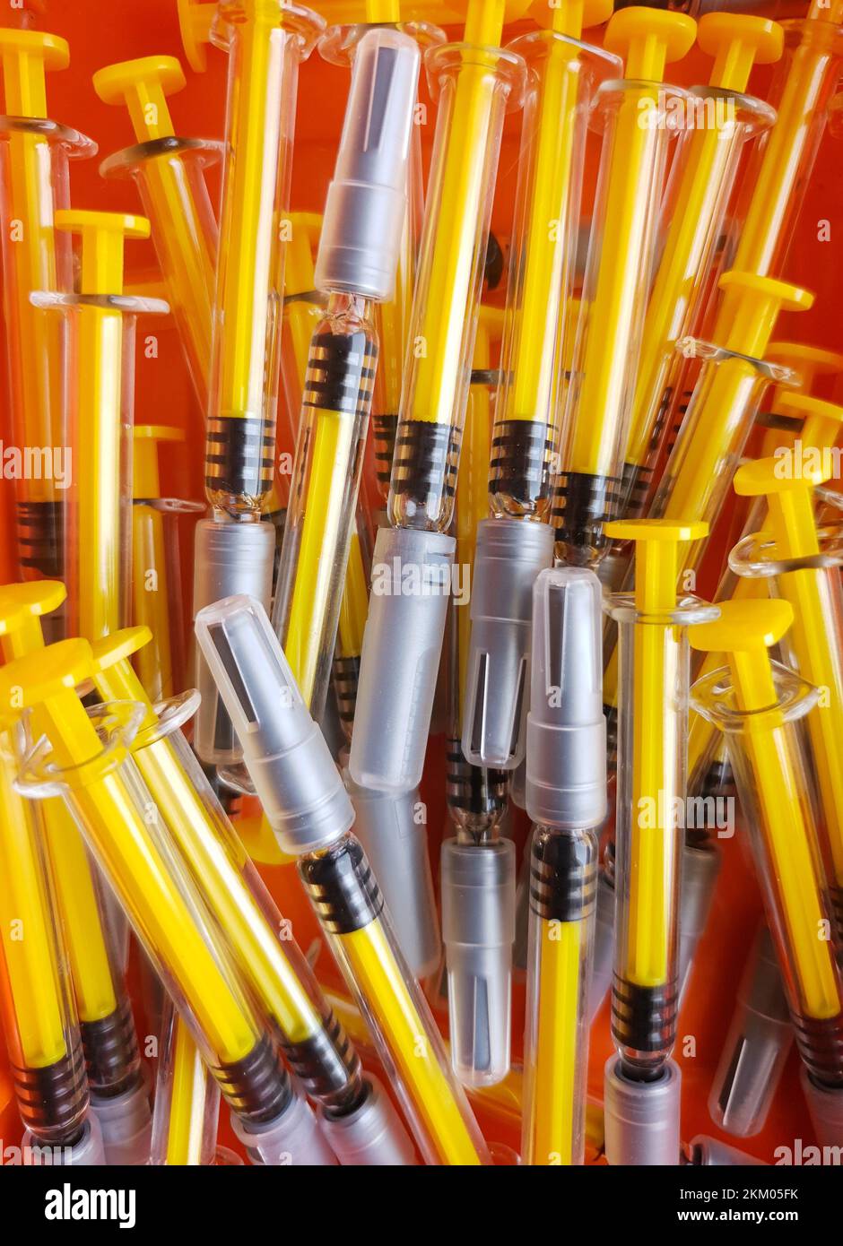 A top view of a pile of used syringes Stock Photo - Alamy