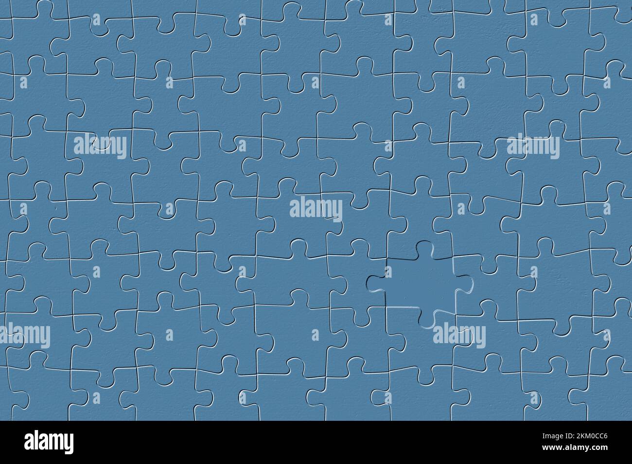 Embossed, missing piece of a blue jigsaw puzzle Stock Photo - Alamy