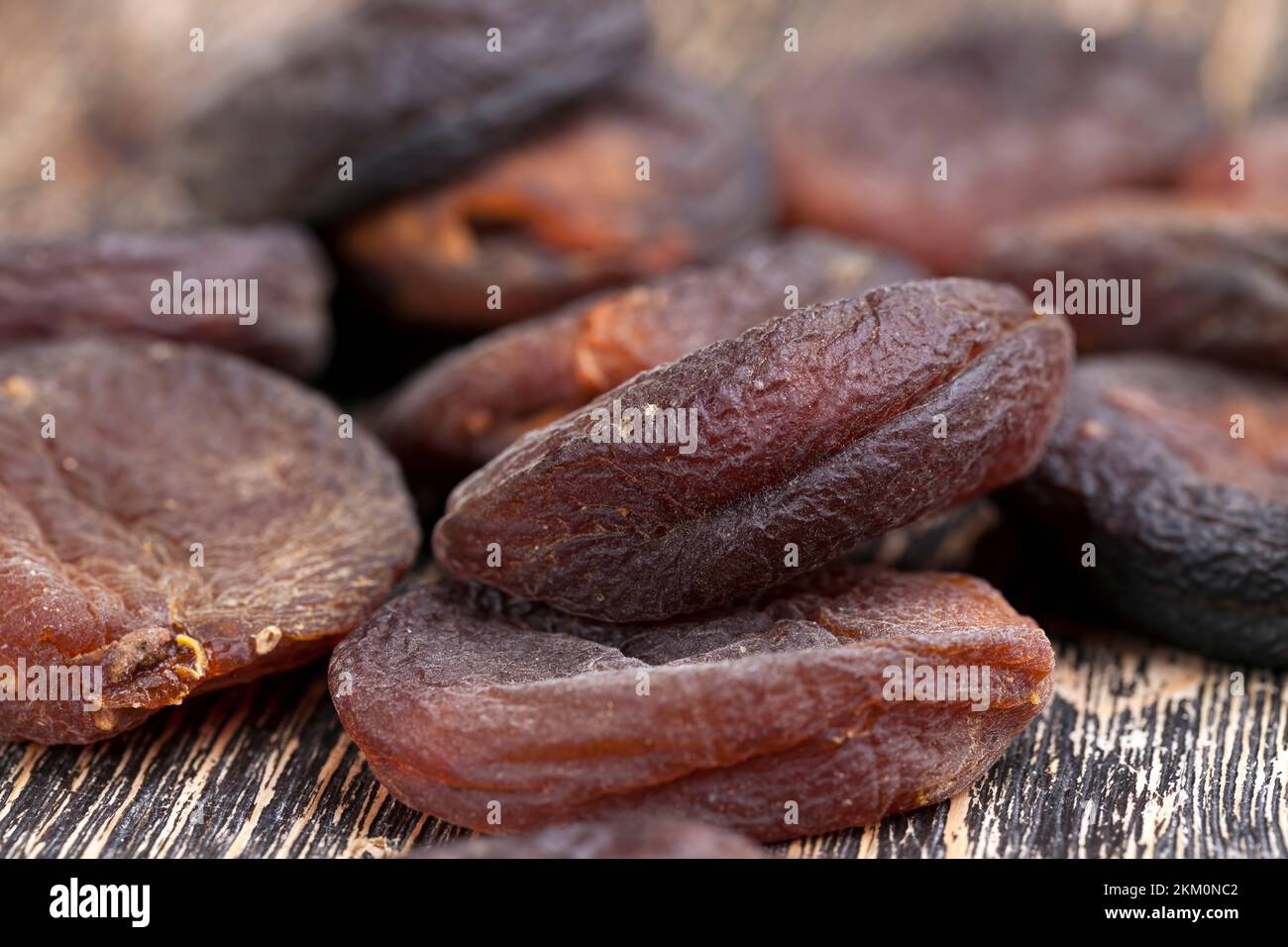 dark dried apricots of large size, dried apricots in sunlight with ...