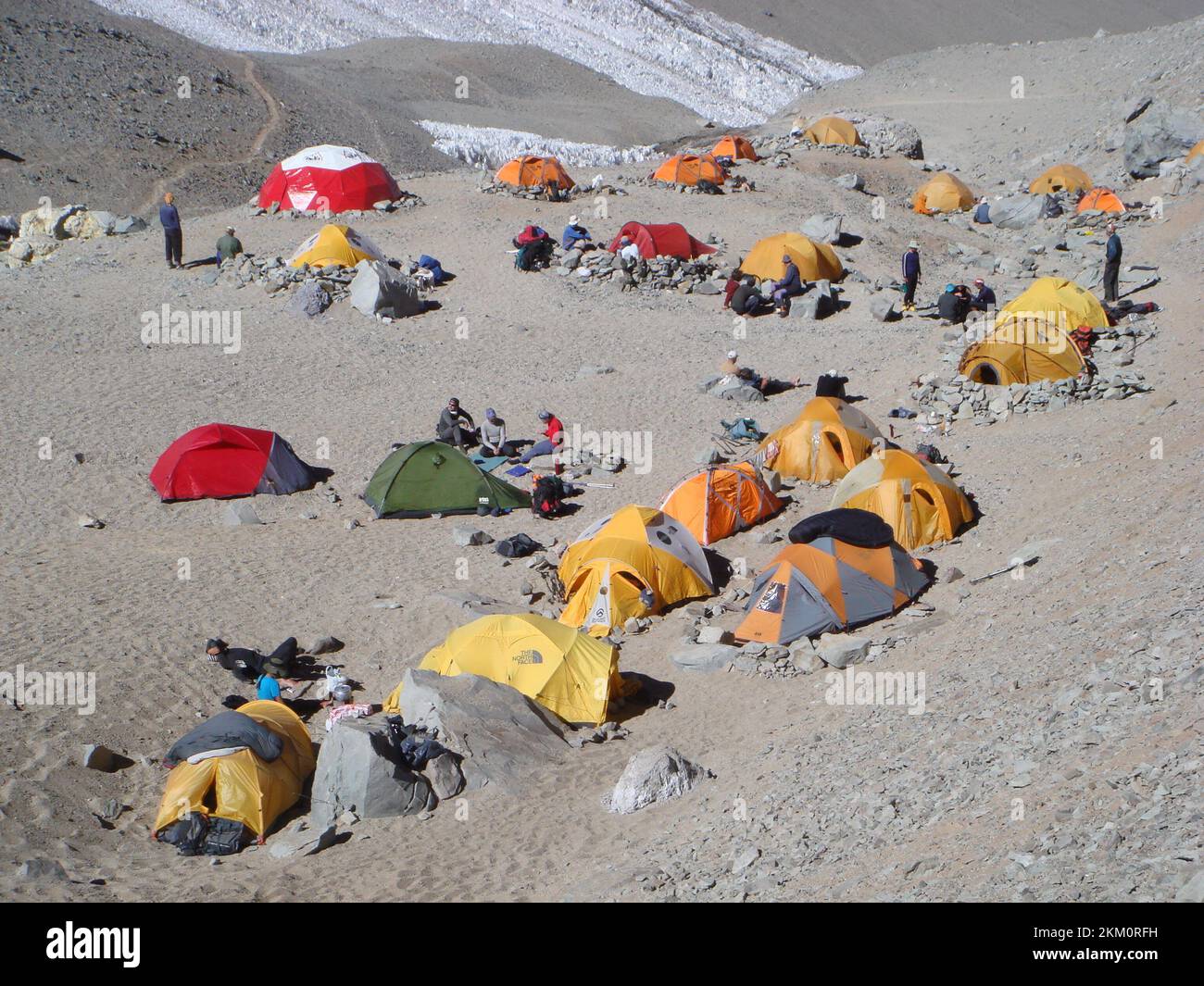 Colorful tents and people in a refuge camp in a deserted area Stock ...