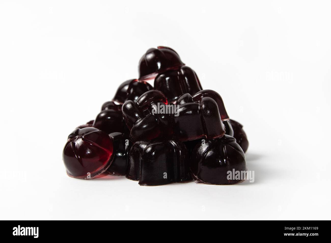 Dark red cherry homemade gelatin candy on white background Stock Photo ...