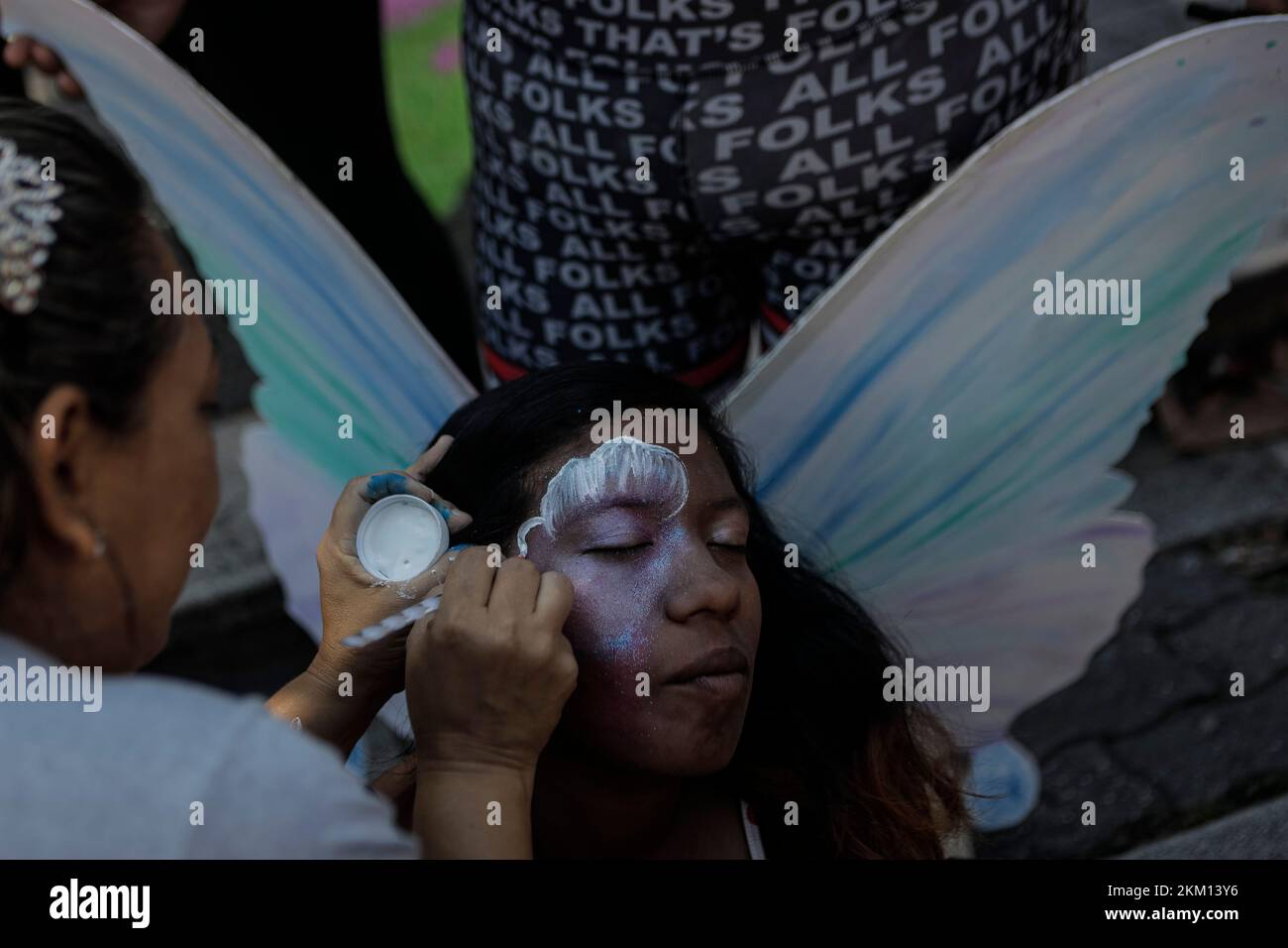 Caracas, Venezuela. 25th Nov, 2022. A woman waits while a butterfly ...