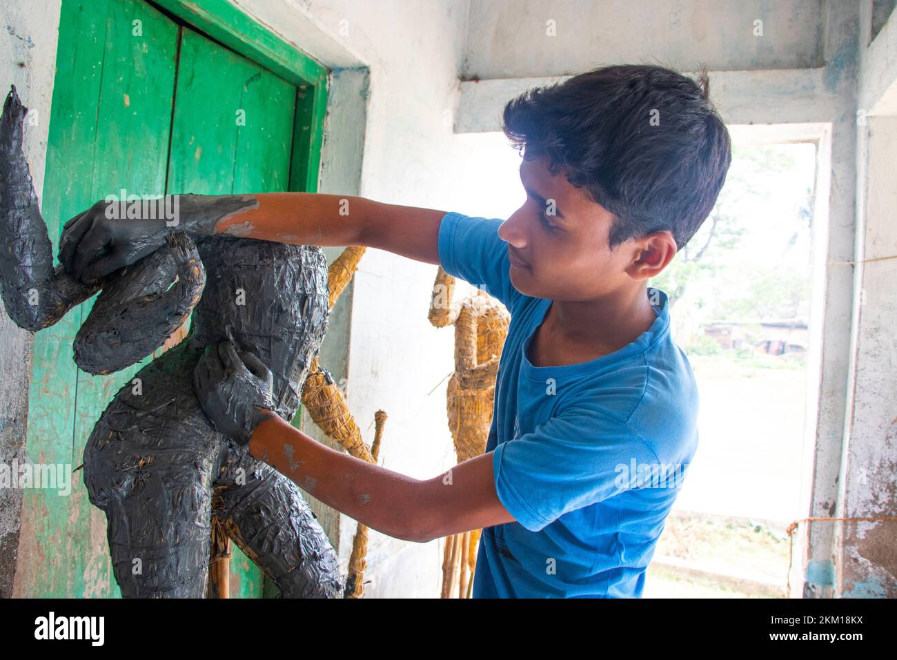 Indian Boy Making Idol Goddess Stock Photo - Alamy