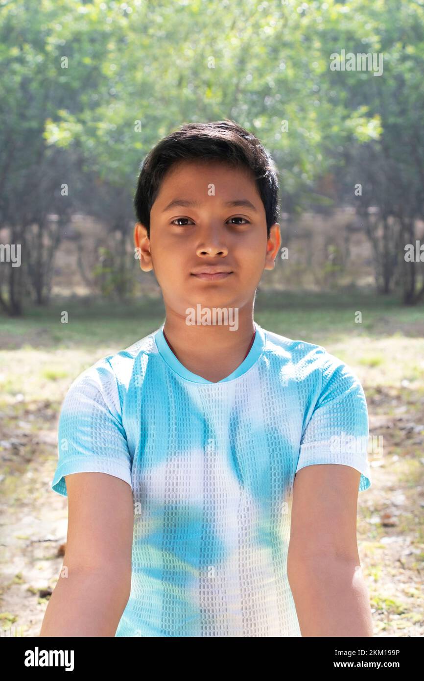 An indian boy doing yoga outdoors Stock Photo - Alamy