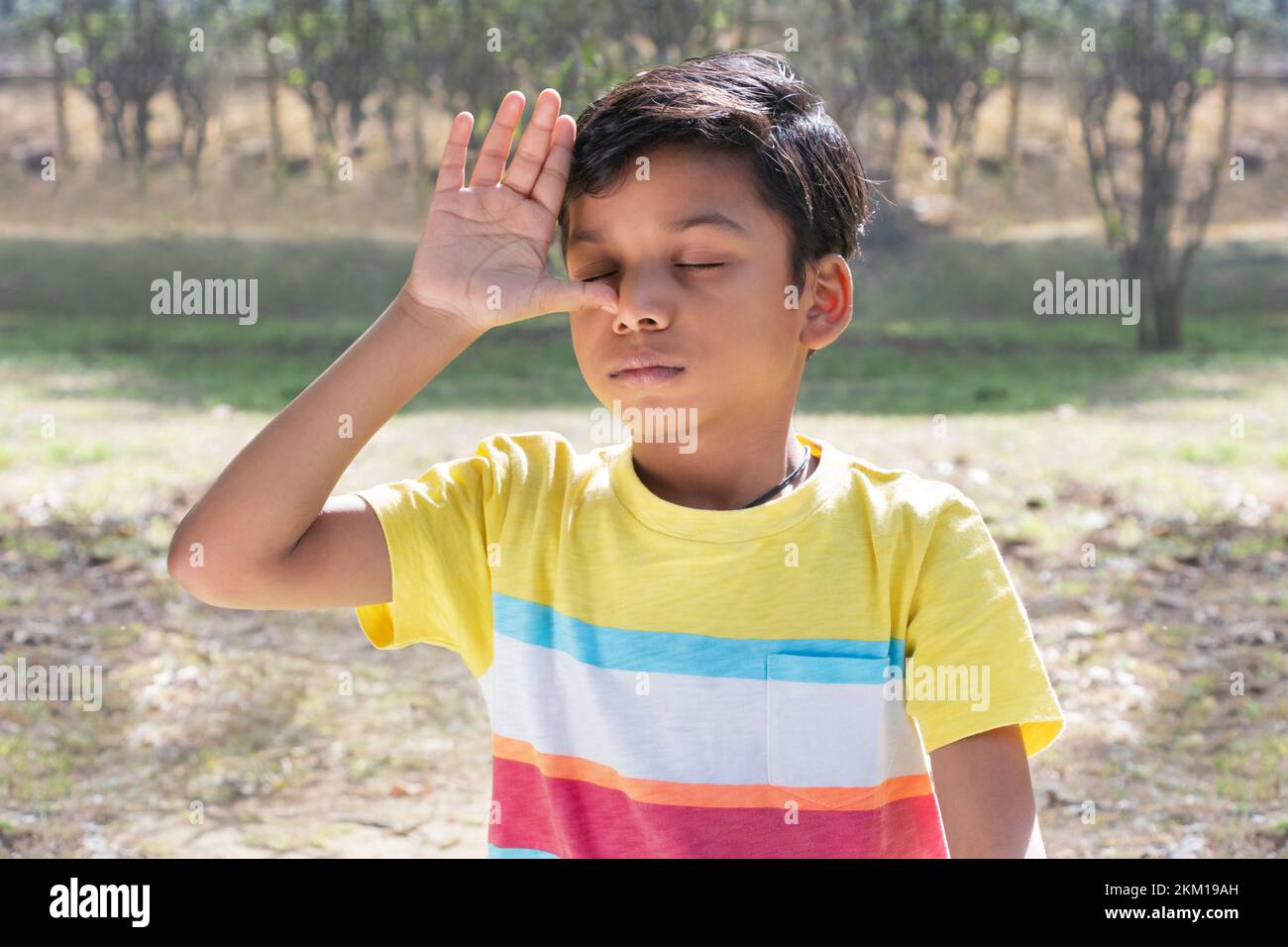 shot of indian boy doing yoga at outdoor Stock Photo - Alamy