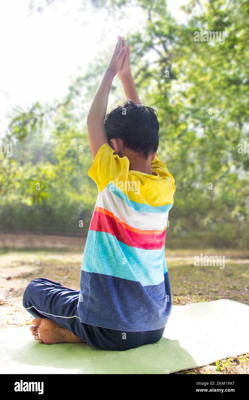 Young Boy doing yoga with hands in prayer position at outdoor Stock ...