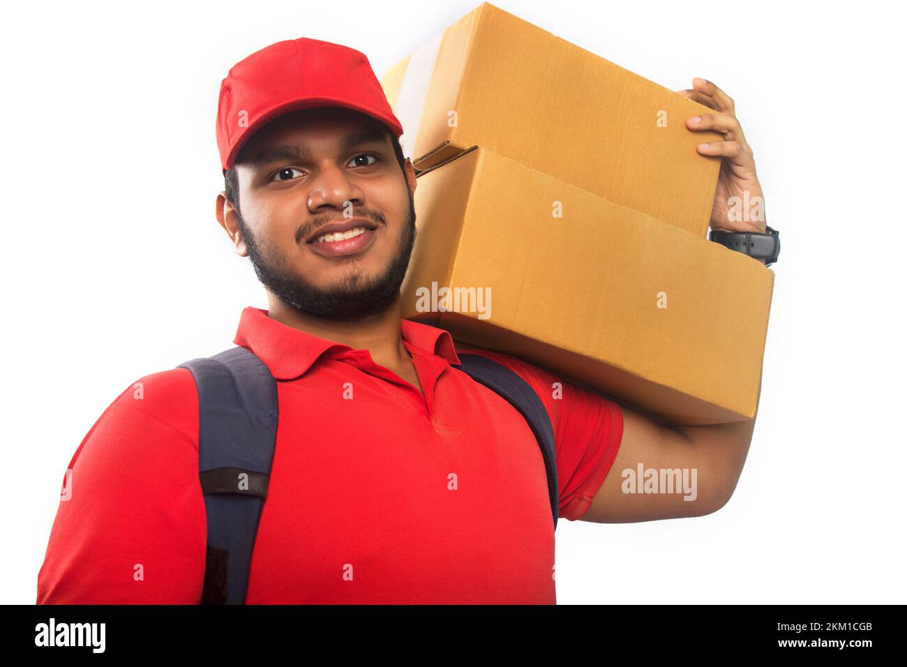 Portrait Of Young Delivery Man Carrying Cardboard Box On Shoulder Stock ...