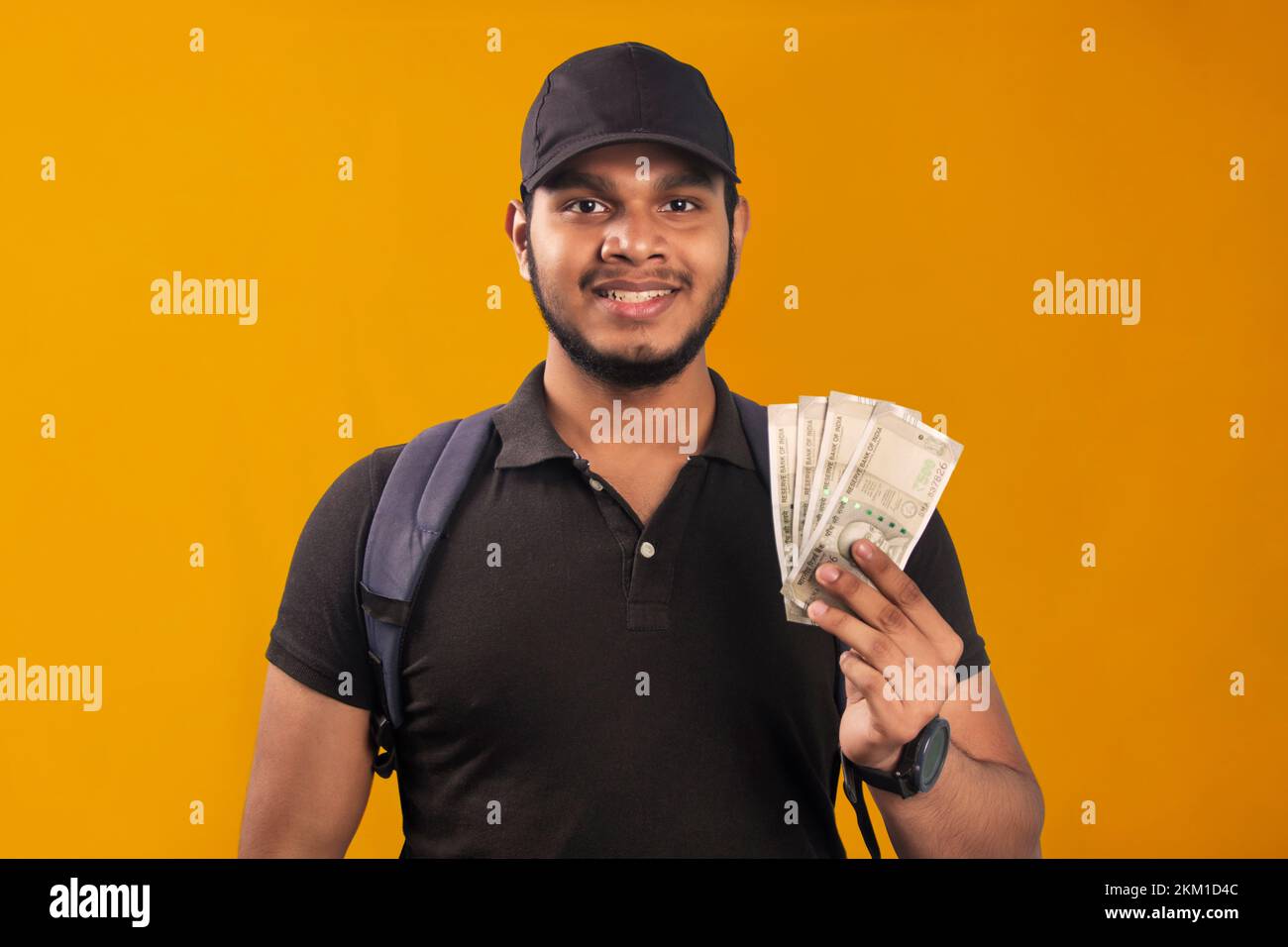 Delivery Man Holding Paper Currency Against White Background Stock ...