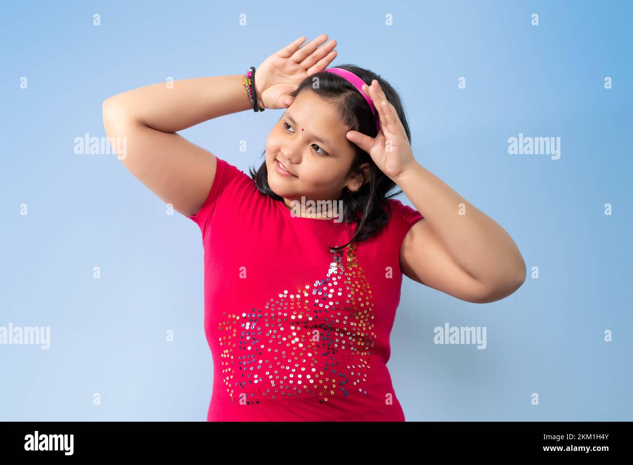 Portrait of girl making a teasing face Stock Photo - Alamy