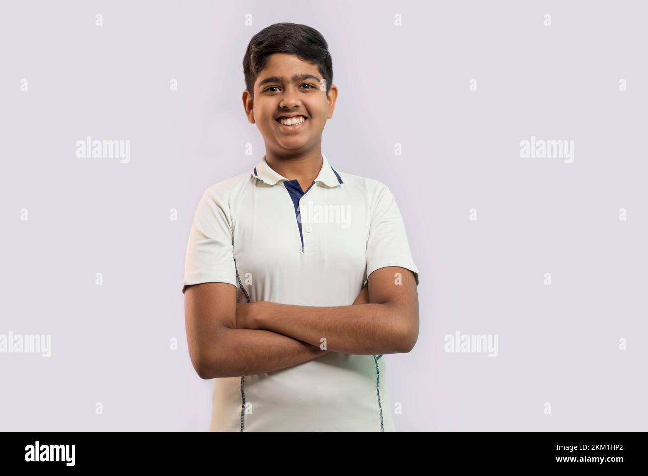 A boy in cricket uniform smiling and standing Stock Photo - Alamy
