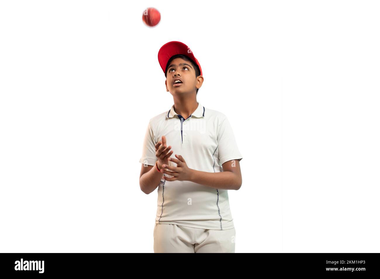 Boy catching cricket ball Stock Photo - Alamy
