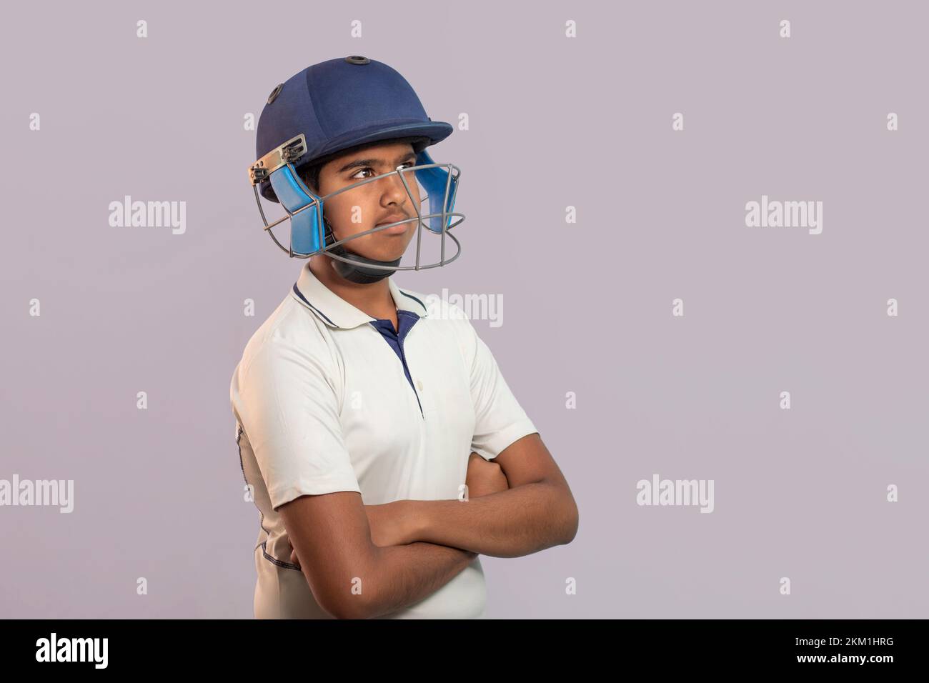 Portrait of boy wearing cricket Helmet looking elsewhere Stock Photo ...