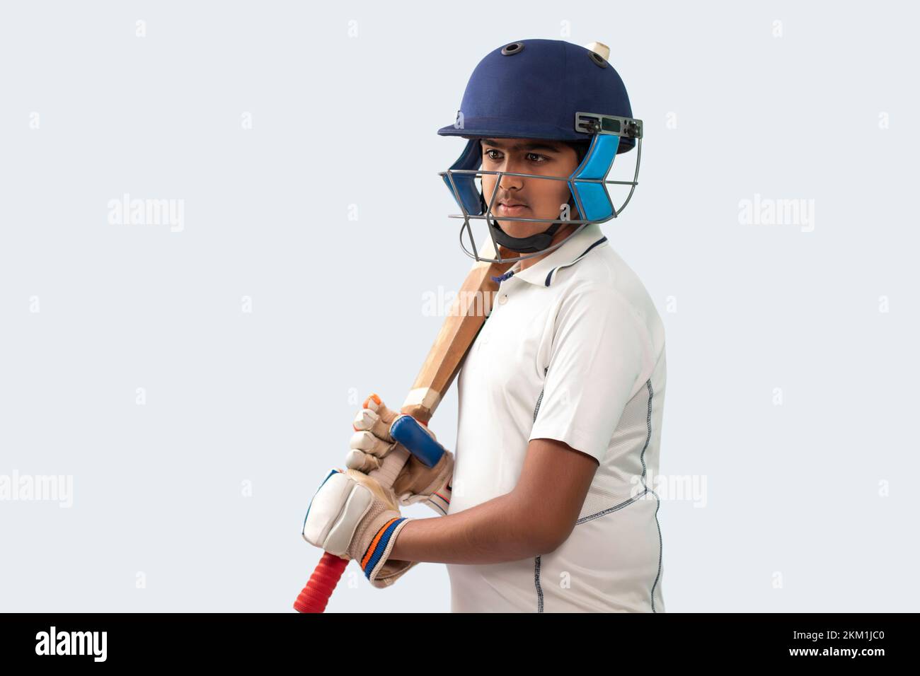 Portrait of boy wearing cricket Helmet and holding Bat Stock Photo - Alamy
