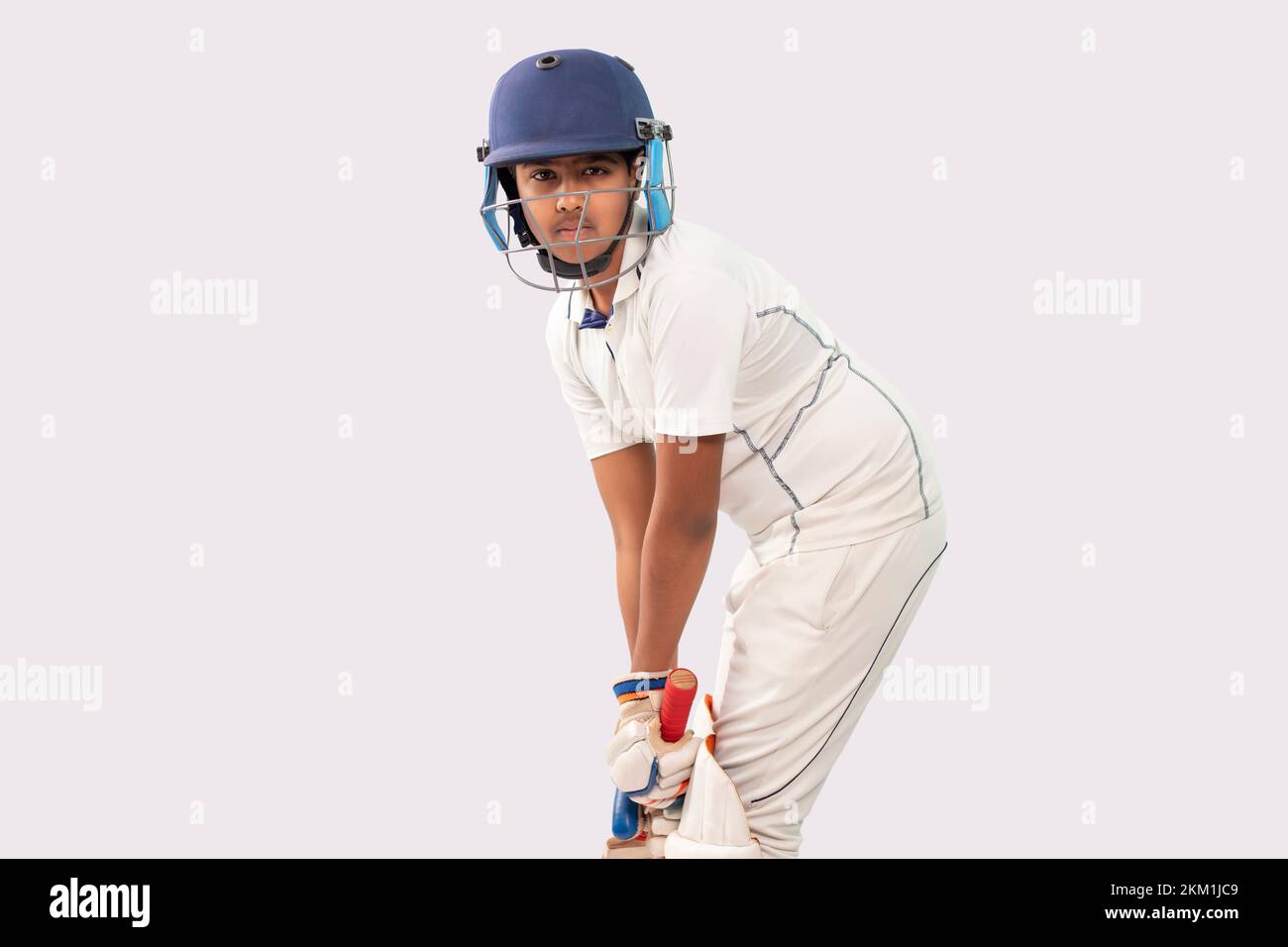 Portrait of boy getting ready to strike During a Cricket Game Stock ...