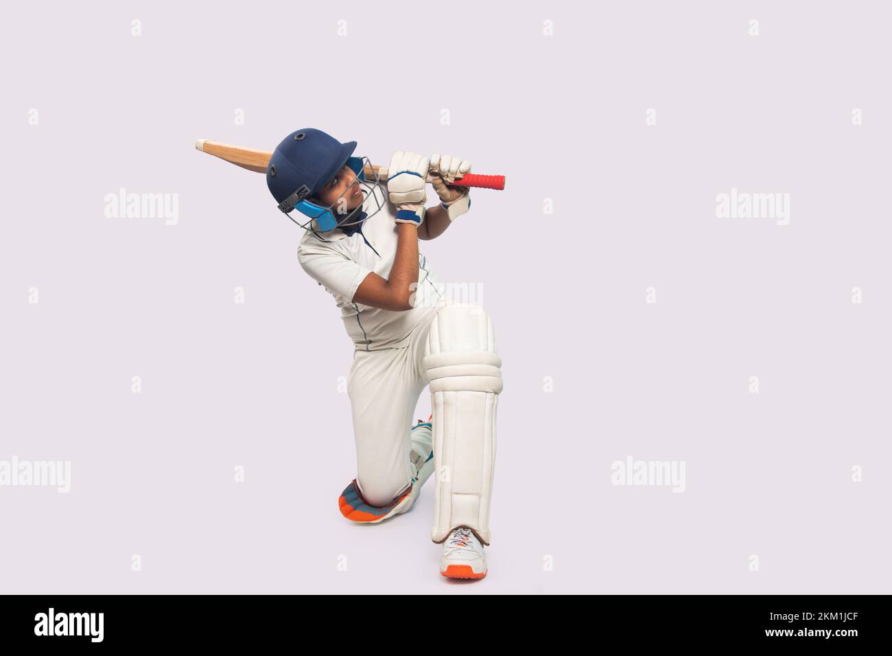 Portrait of boy hitting a shot During a Cricket Game Stock Photo - Alamy