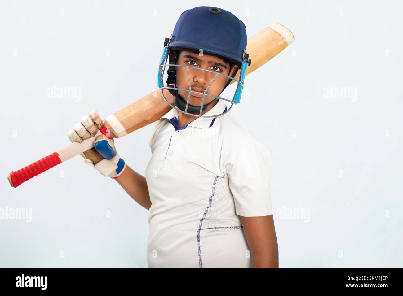 Portrait of boy wearing cricket Helmet and holding Bat Stock Photo - Alamy