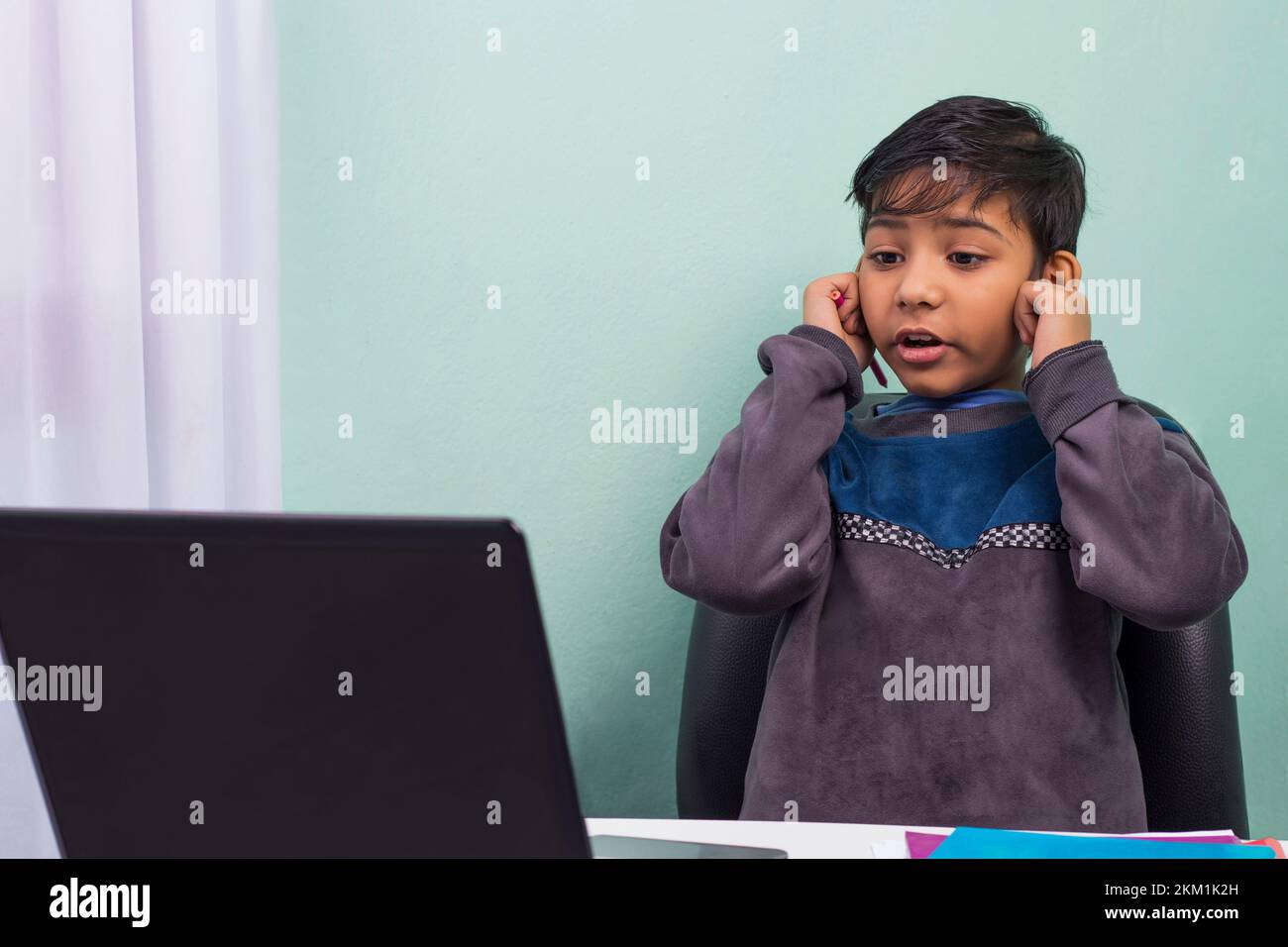 Boy pulling ear hi-res stock photography and images - Alamy
