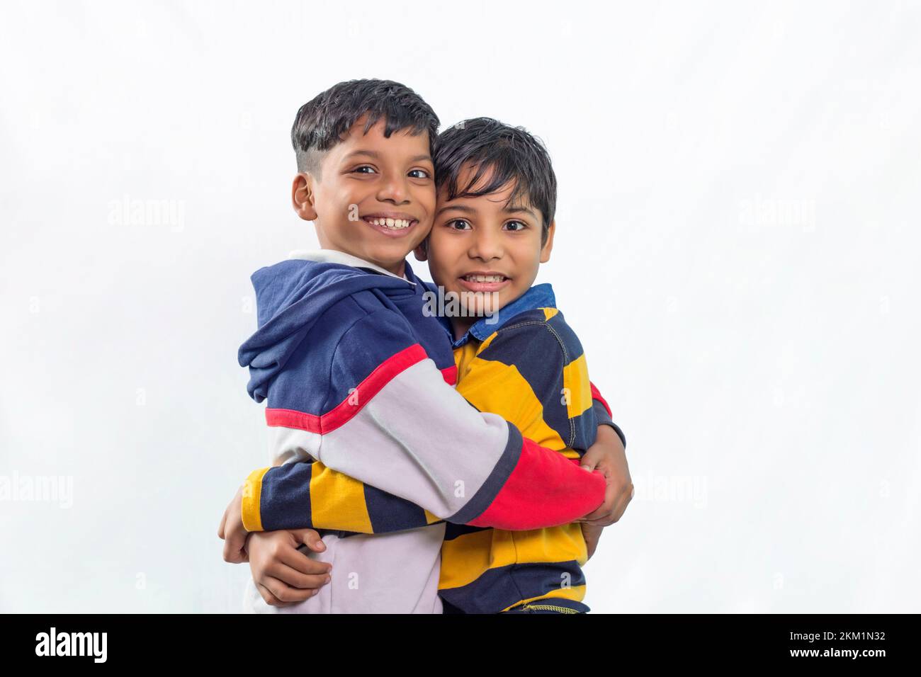 portrait of two kid boys hugging each other Stock Photo - Alamy