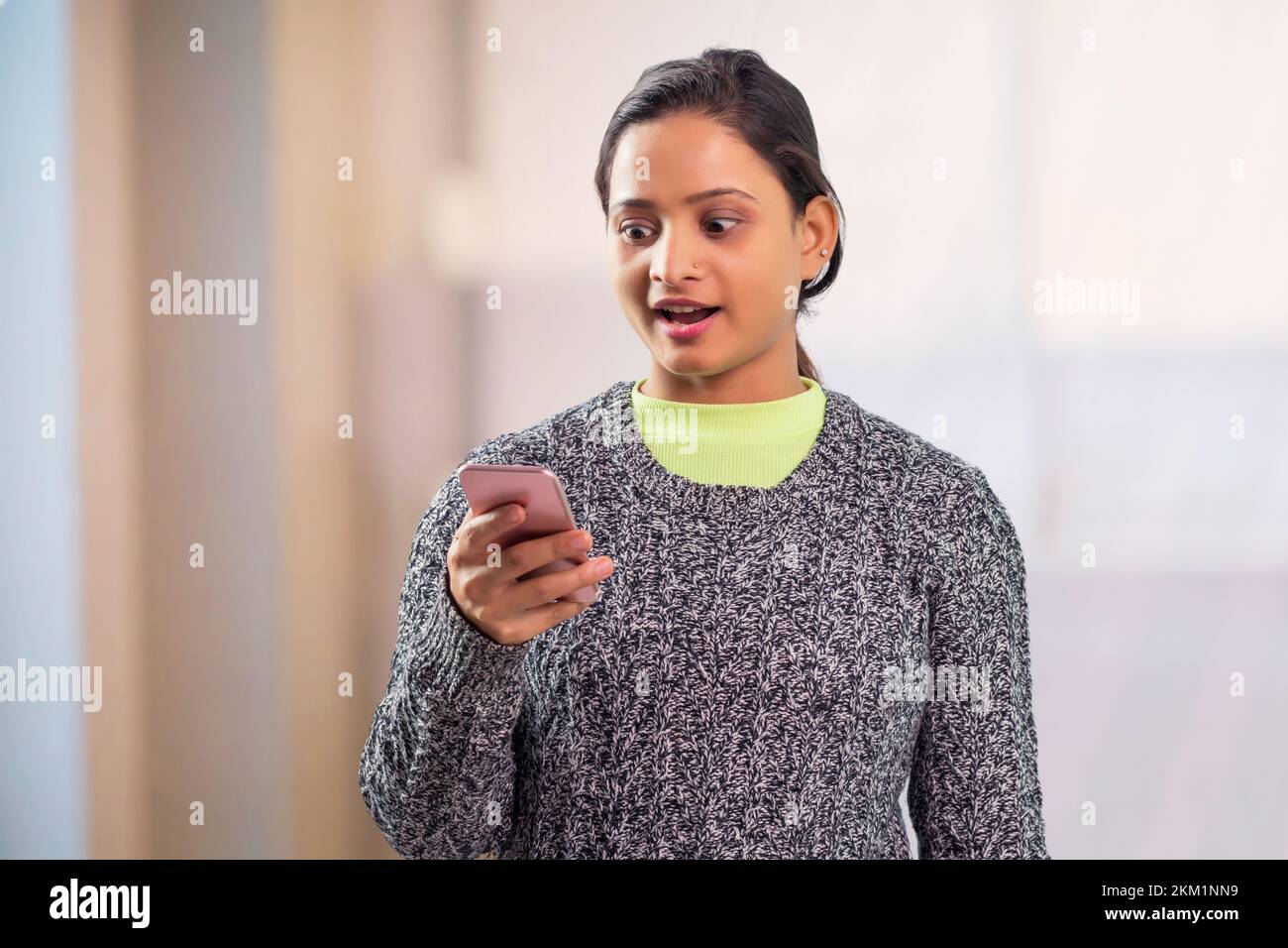 Indian young women using smartphone Stock Photo - Alamy