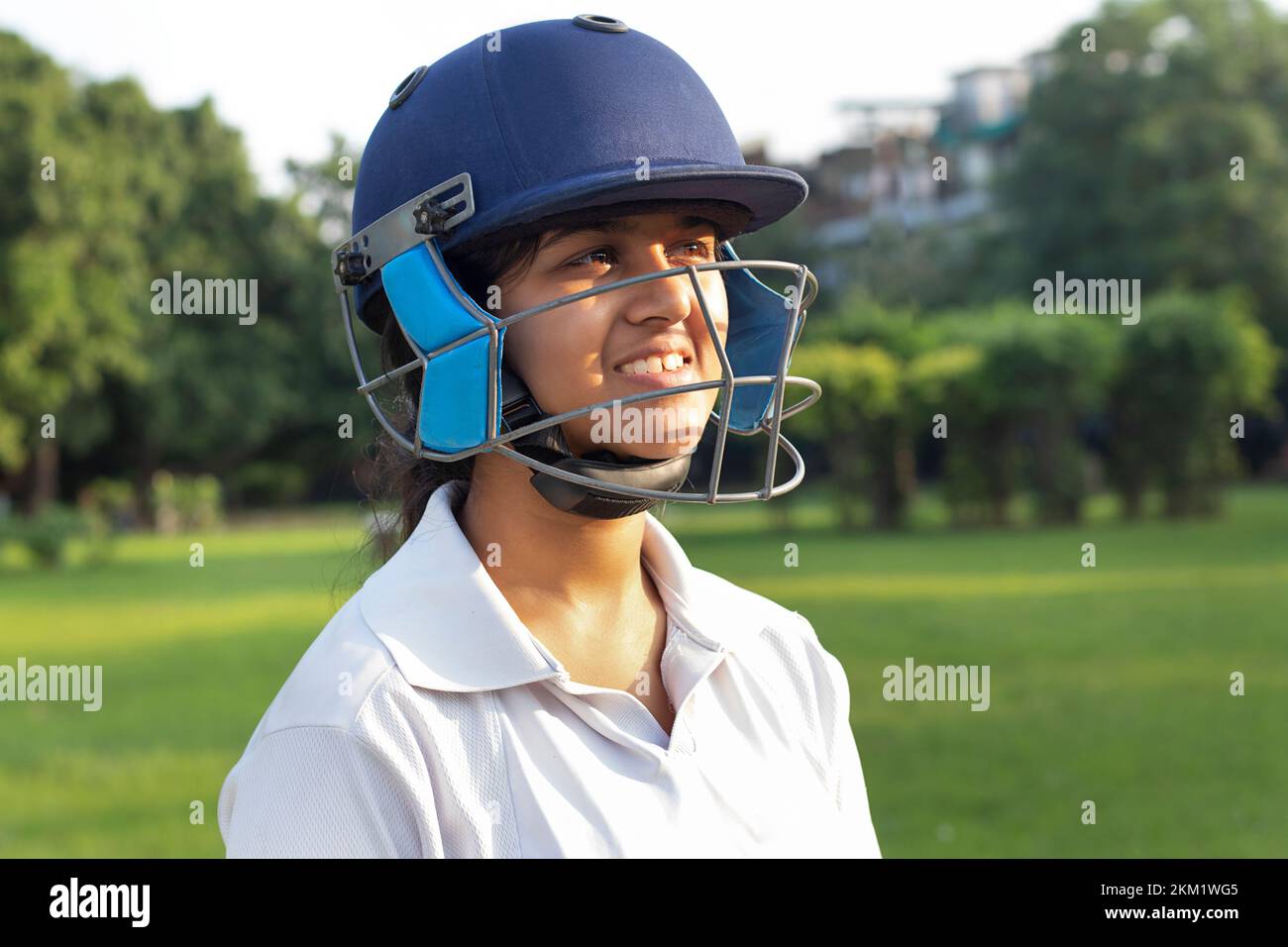 Portrait of a young cricket girl in cricket helmet Stock Photo - Alamy