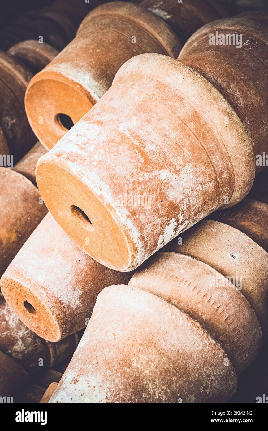 A close-up shot of a pile of terracotta flower pots at Eythrope Gardens ...