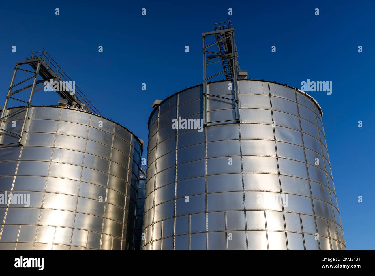 modern metal silo of large size, a silo at an agricultural enterprise ...