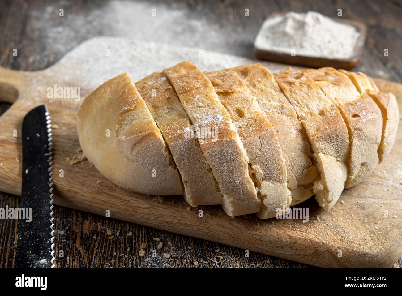 cut fresh bread into pieces while cooking with bread, the bread is cut ...