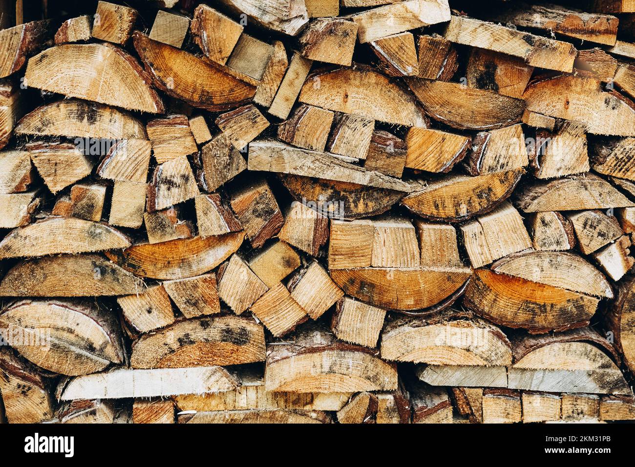 Many wooden logs stacked in a row - stock photo Stock Photo - Alamy