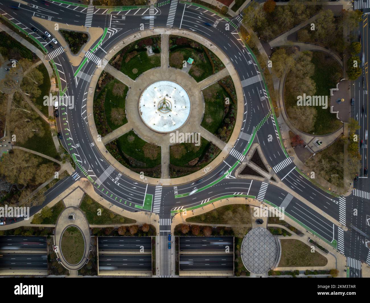 A drone view of a roundabout with trees in PhiladelphiaCity in ...