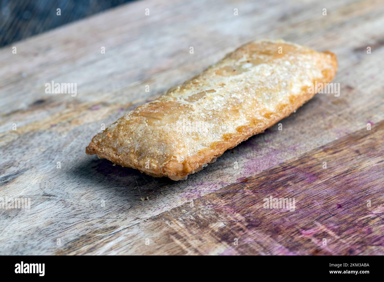 wheat pastries with red cherry strawberry filling on a board, dried ...