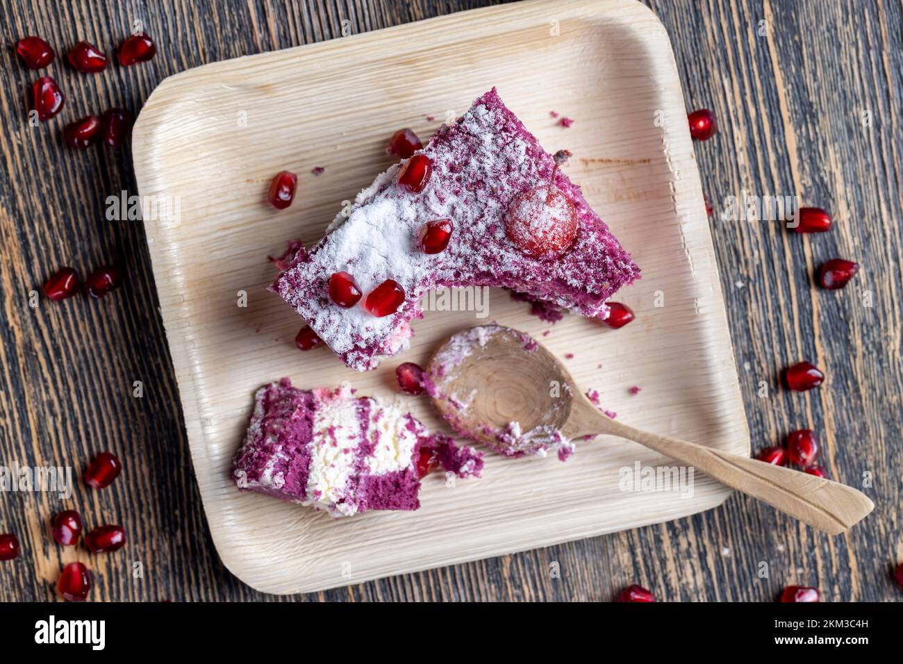 a maroon colored cake with the taste of different berries and a creamy ...