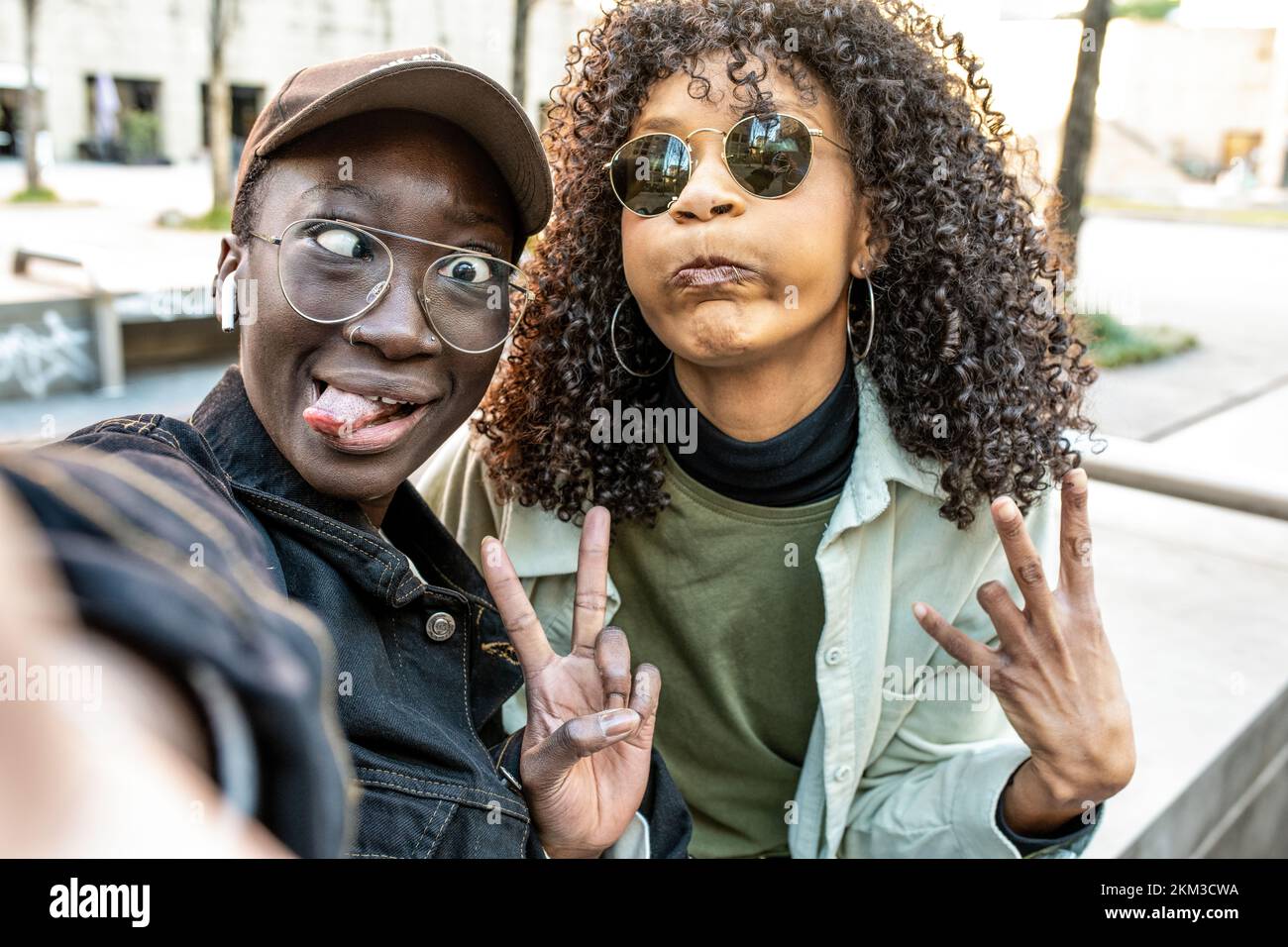foolish selfie of two young women, generation z people using smart ... foolish selfie of two young women, generation z people using smart ...