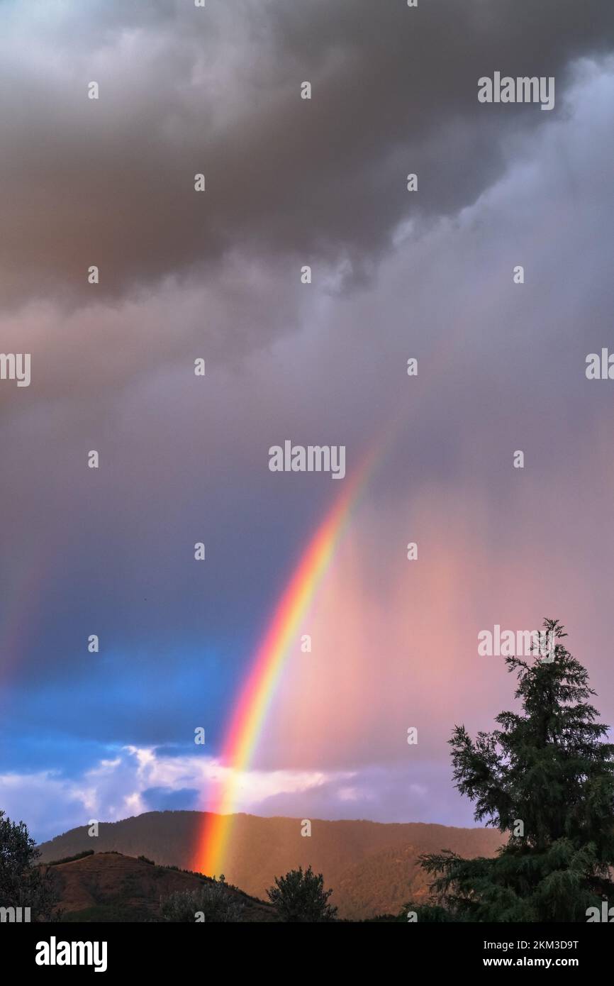 Rainbow through dramatic stormy hi-res stock photography and images - Alamy