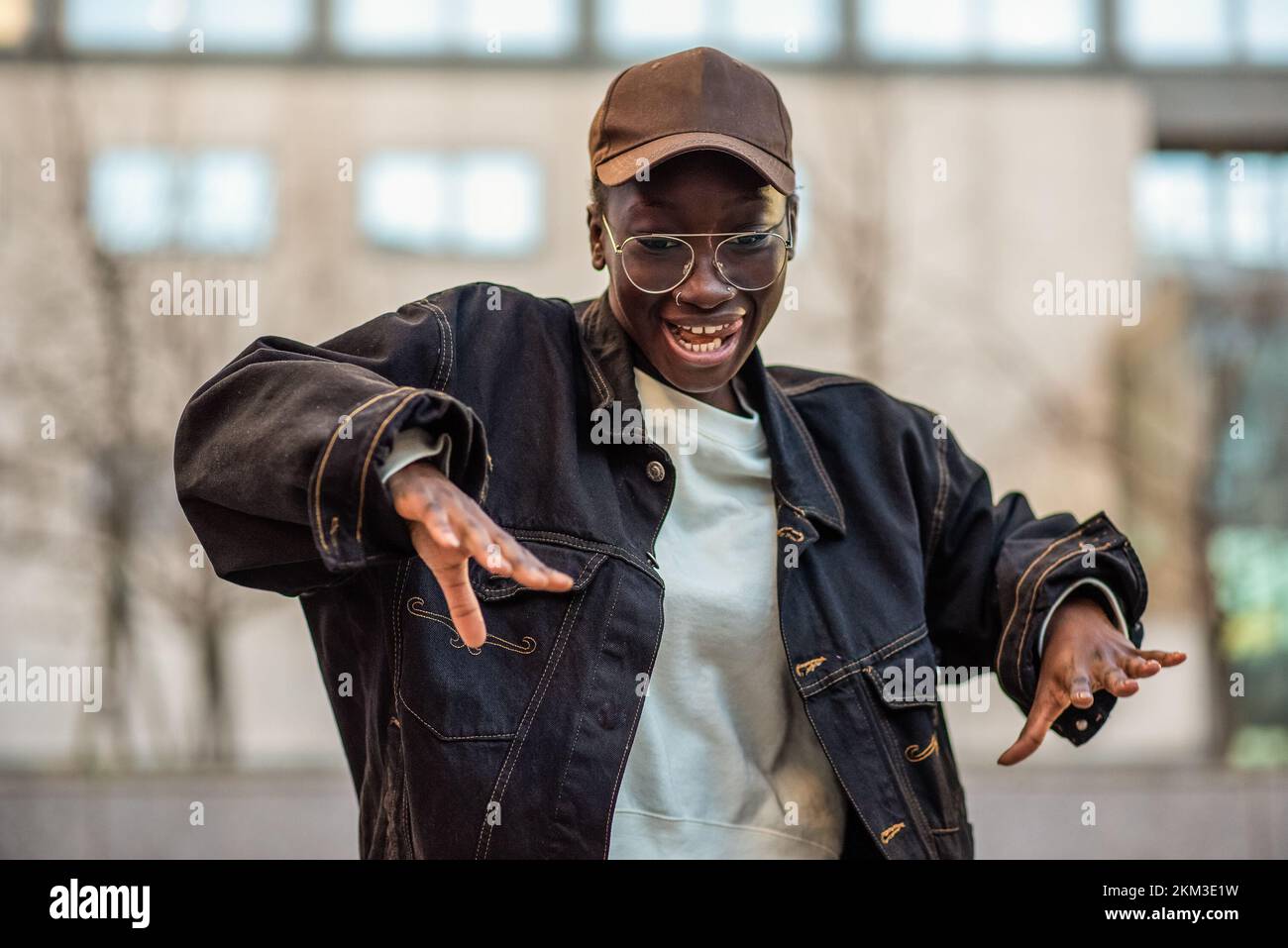 portrait of a young african woman dancing hip hop style, detail of the ...