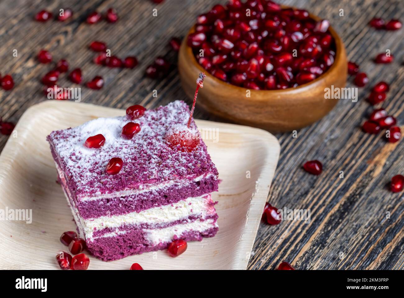 a maroon colored cake with the taste of different berries and a creamy ...