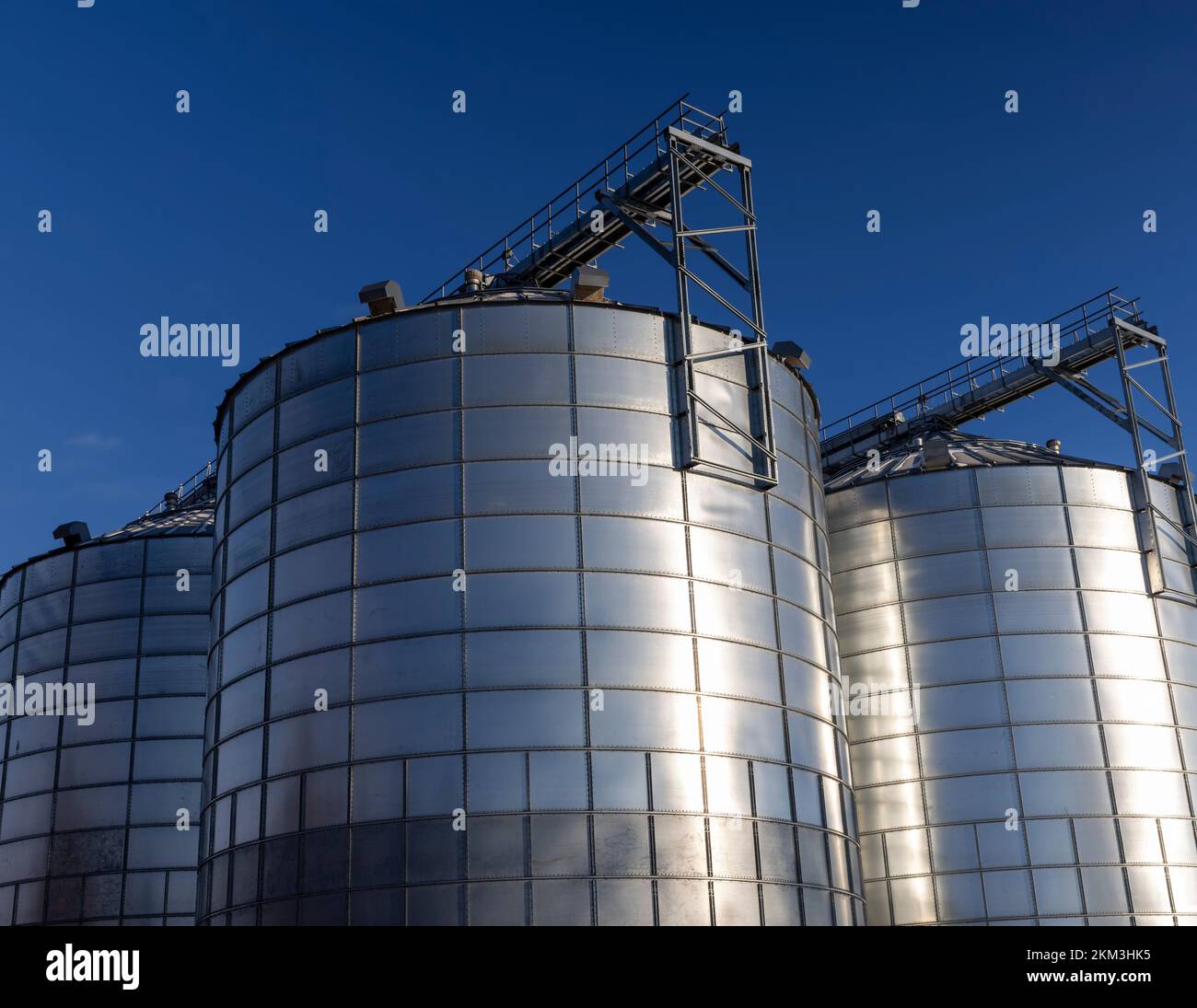 modern metal silo of large size, a silo at an agricultural enterprise ...