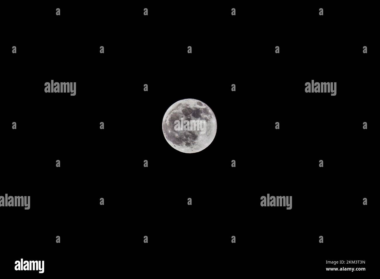 glowing full moon in the night sky during midnight. full white moon ...