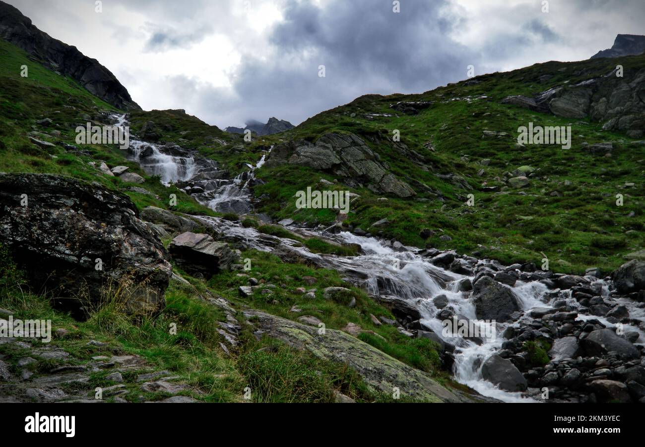 waterfall in the dolomites alps in Italy Stock Photo - Alamy